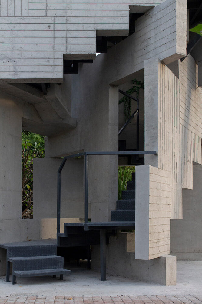 vertical tower by CLAB architects rises from concrete walls in china