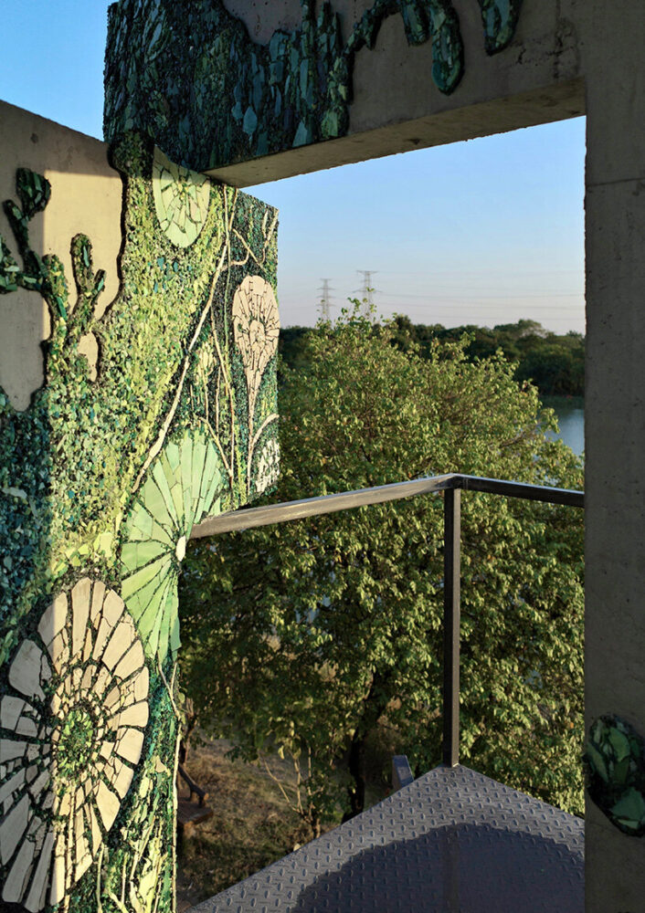 vertical tower by CLAB architects rises from concrete walls in china