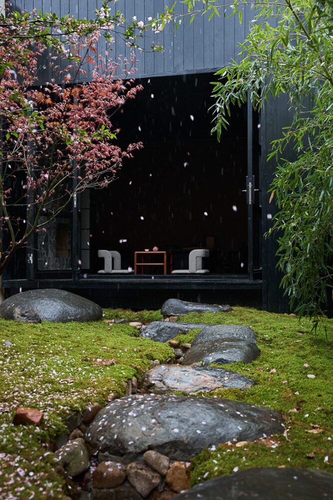 tea house by qicang design embraces seasonal rhythms behind sliding ...