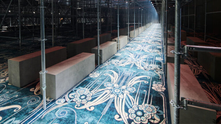 AMO surrounds prada FW25 set design with scaffolding structures