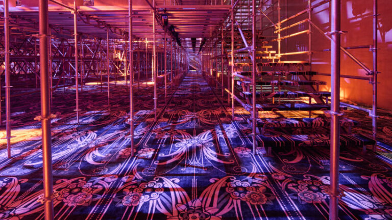 AMO surrounds prada FW25 set design with scaffolding structures