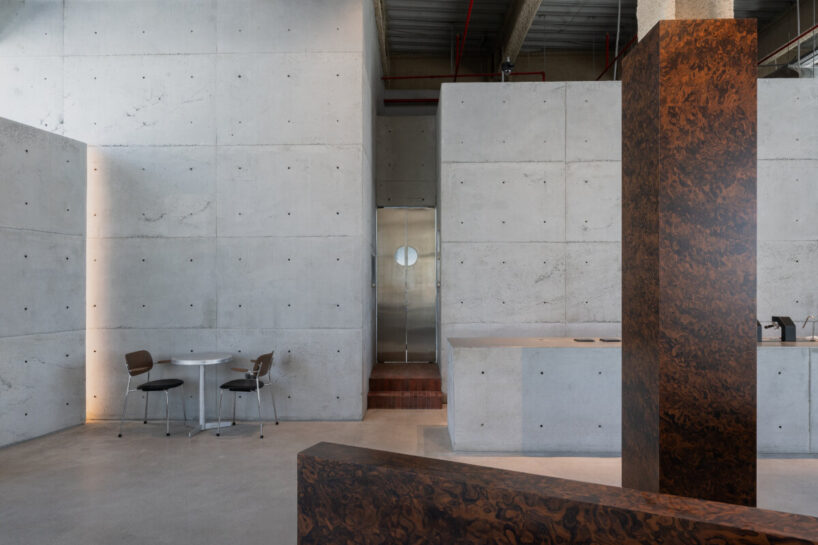 shell+core’s cafe in abu dhabi embraces wabi-sabi and brutalism