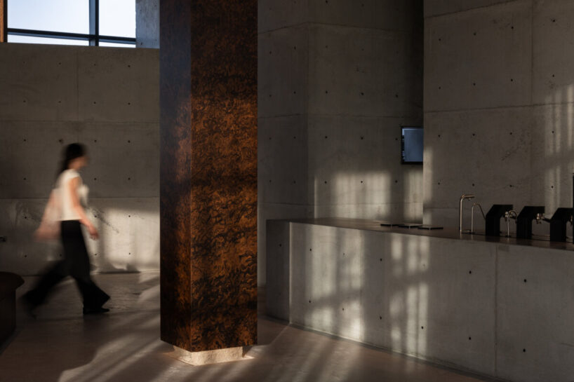 shell+core’s cafe in abu dhabi embraces wabi-sabi and brutalism