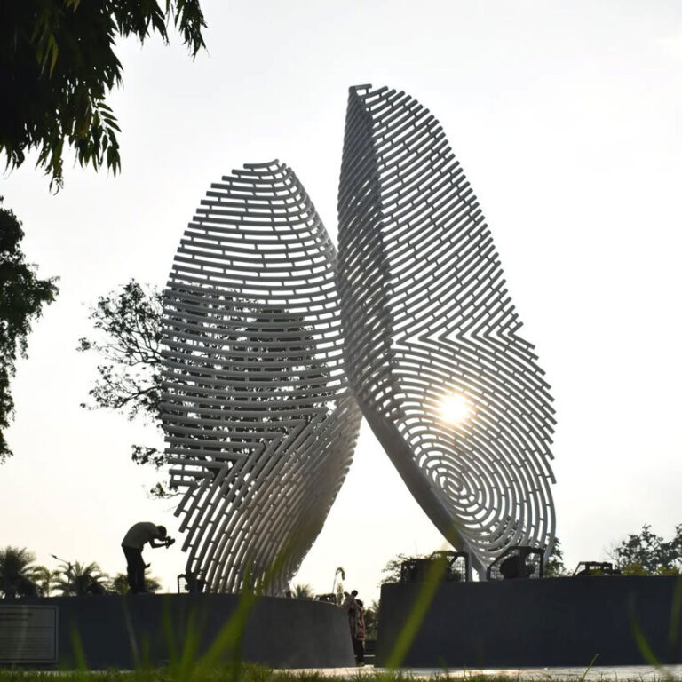 sculptural steel installation shapes touching fingerprint ridges