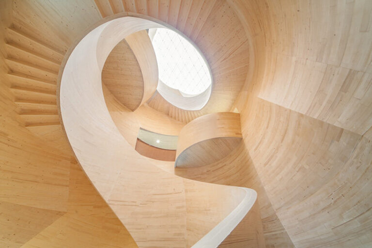 spiraling timber atrium by ICD connects floors at blumer lehmann HQ in ...
