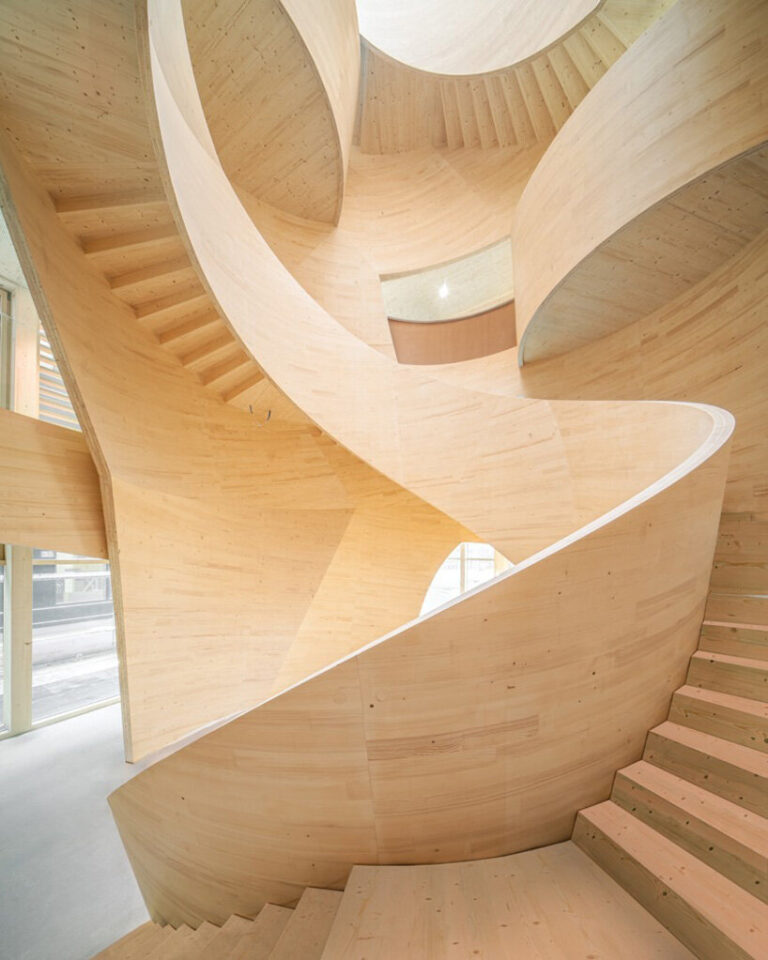 spiraling timber atrium by ICD connects floors at blumer lehmann HQ in ...