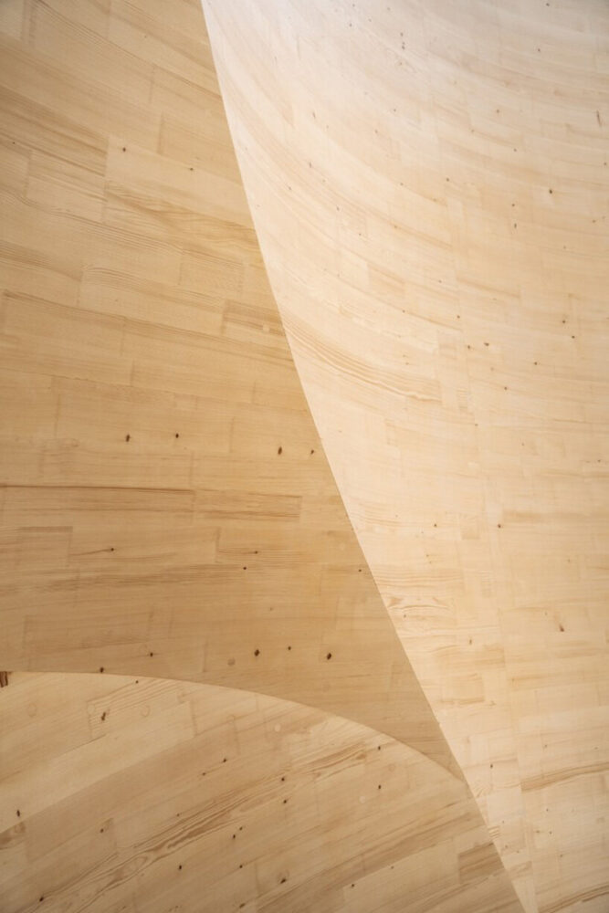 spiraling timber atrium by ICD connects floors at blumer lehmann HQ in ...