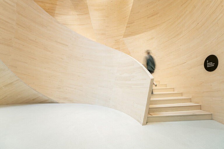 spiraling timber atrium by ICD connects floors at blumer lehmann HQ in ...