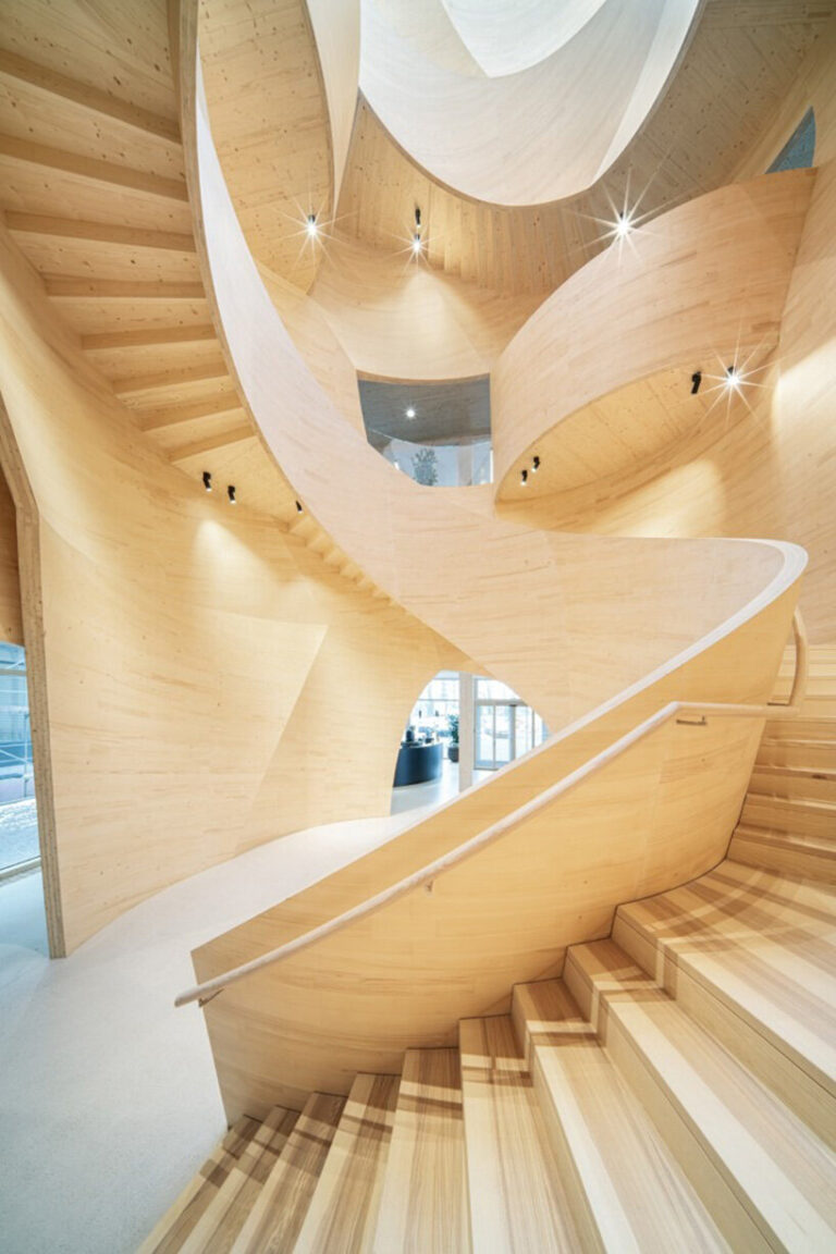 spiraling timber atrium by ICD connects floors at blumer lehmann HQ in ...