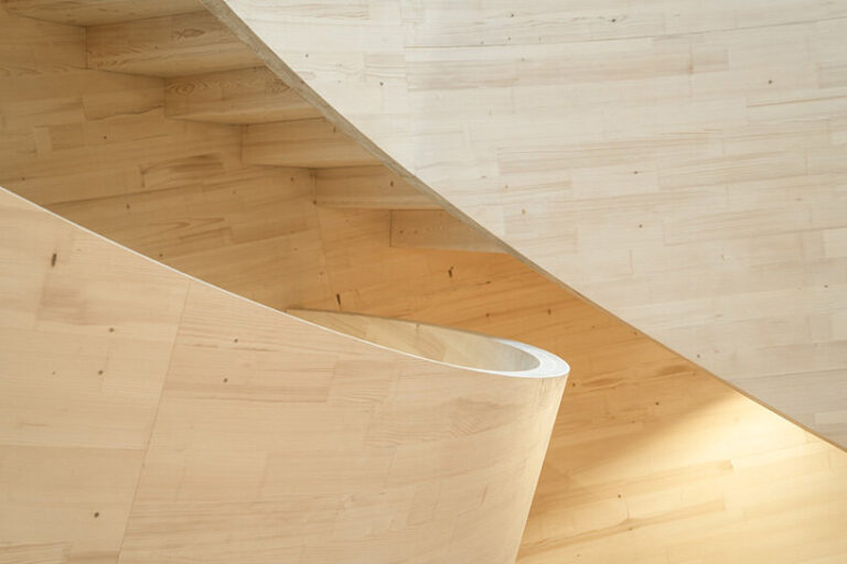 spiraling timber atrium by ICD connects floors at blumer lehmann HQ in ...