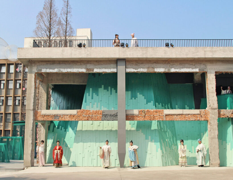 wutopia lab's layered green facade transforms factory into theater
