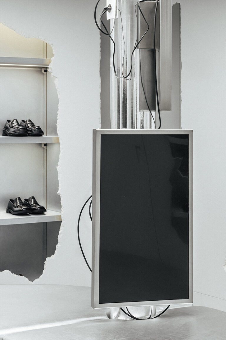 crosby studios brings crushed concrete displays to camperlab's debut paris flagship store