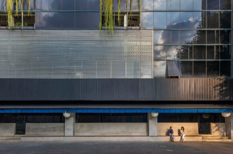 indigo fabric partitions float above sculpted concrete counters in ...