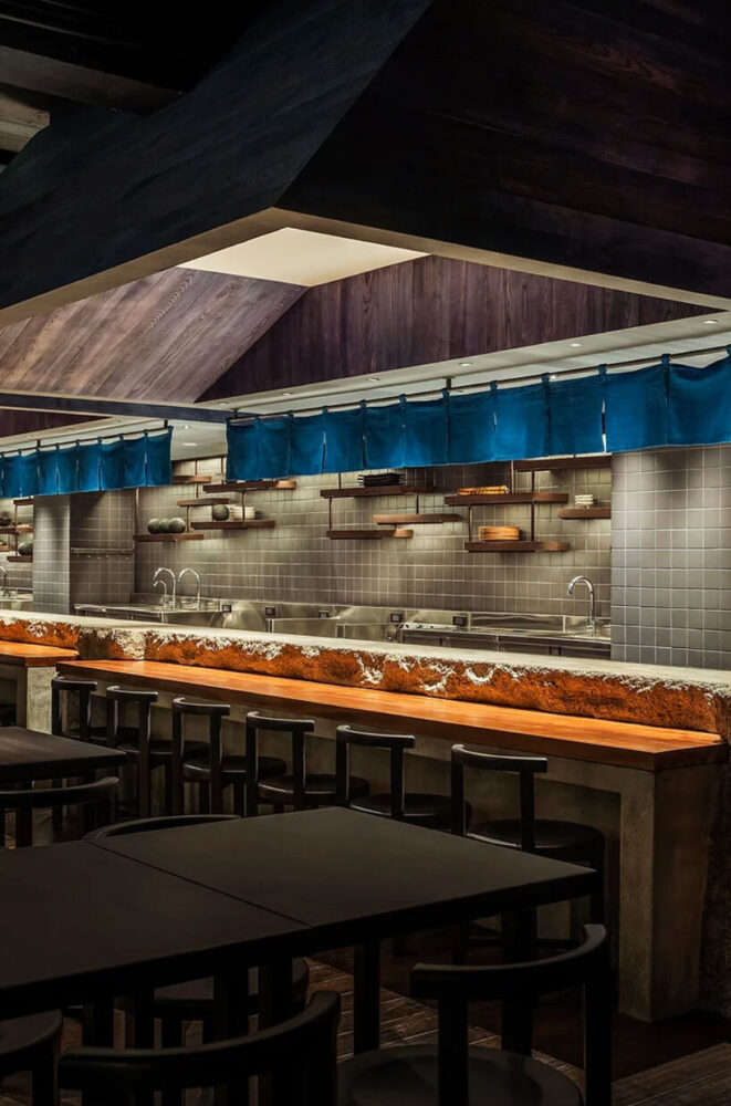 indigo fabric partitions float above sculpted concrete counters in ...