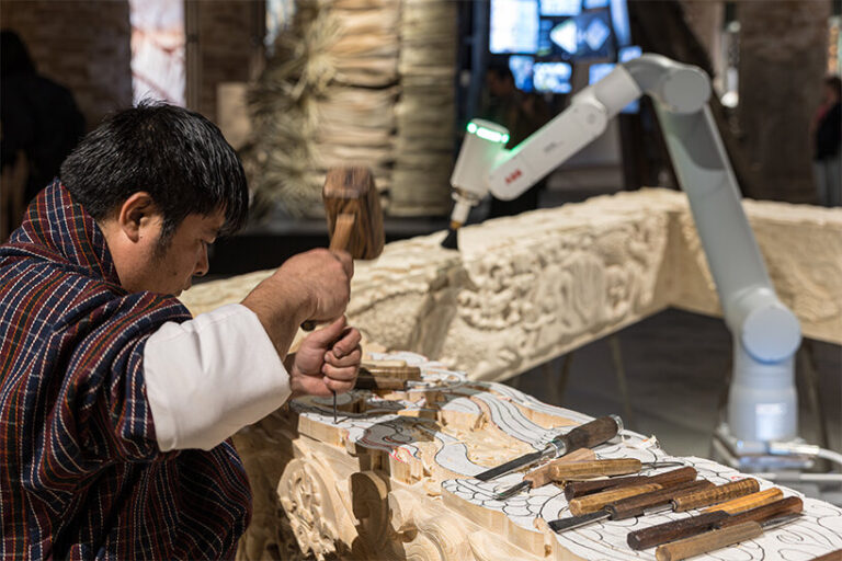 BIG's 'ancient future' fuses hand-carving and robotics at venice biennale 2025