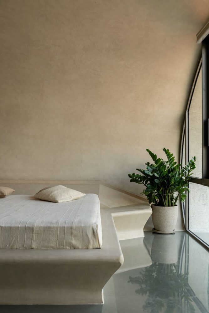 carapace house by achyutam designs carves into concrete in india