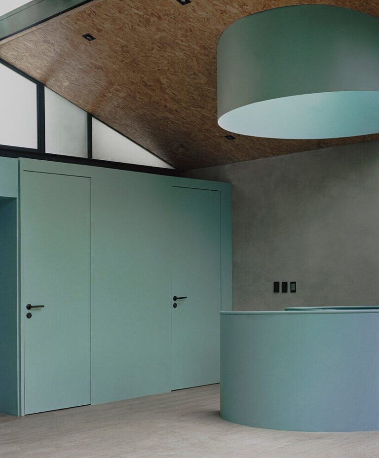 green metal accents bring color to amasa estudio's 1940s home ...