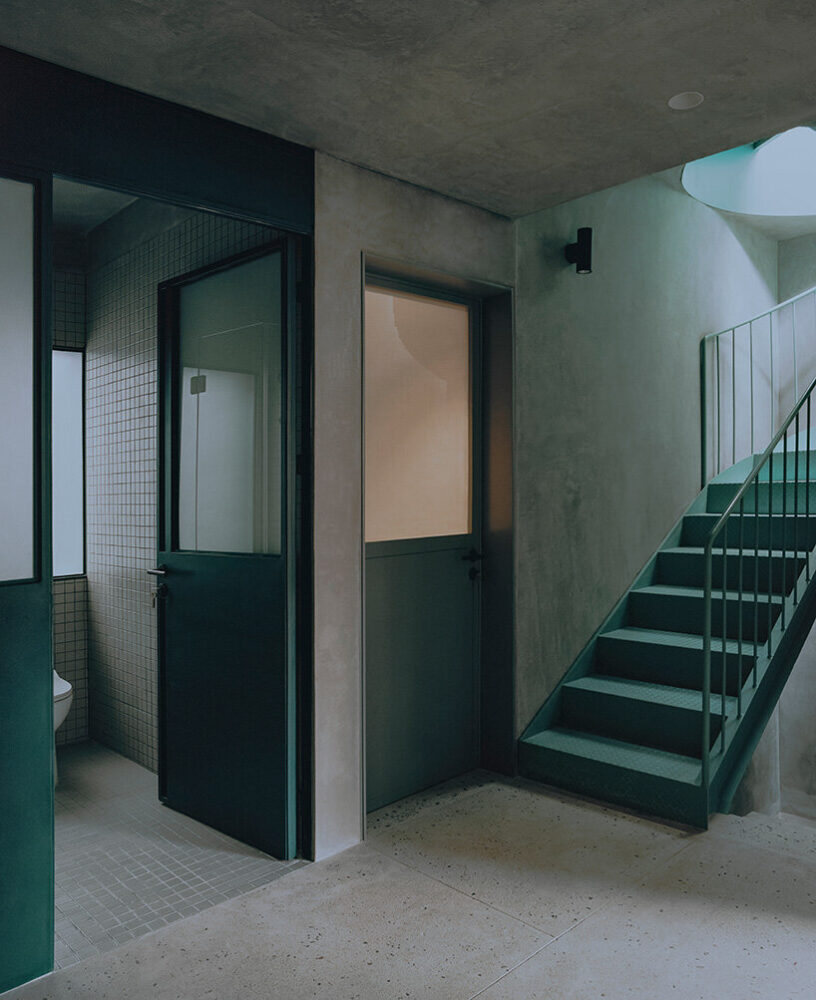 green metal accents bring color to amasa estudio's 1940s home ...