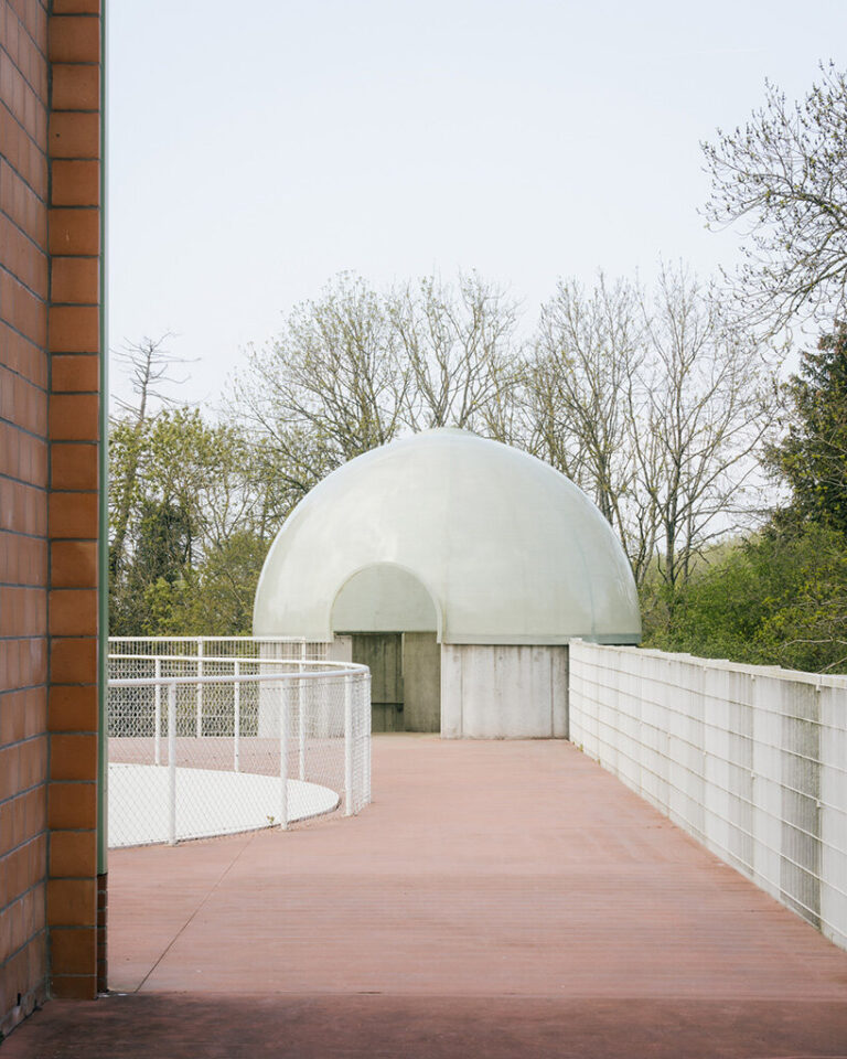 label tops sports center walkway with translucent dome in belgium