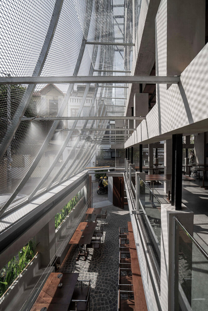metal veil by KHOA VU turns vietnamese villa into a restaurant