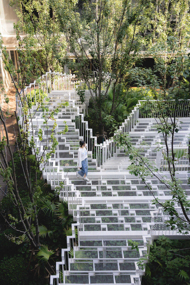 staircase threads through sunken courtyard by TROP in shanghai
