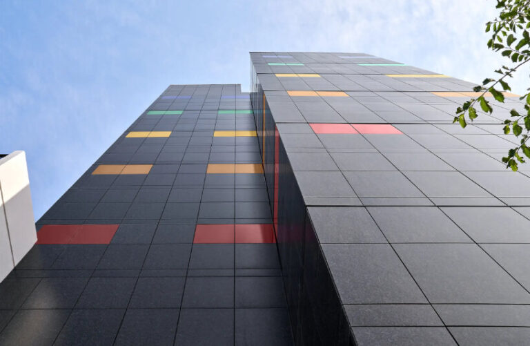 colorful solar facades and murals power up sunrise tower in canada