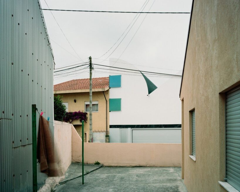 fala atelier inverts the sloped roof for sculptural home in portugal