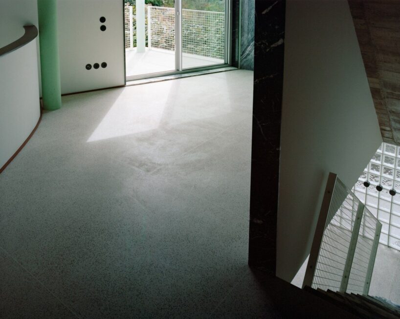 fala atelier inverts the sloped roof for sculptural home in portugal