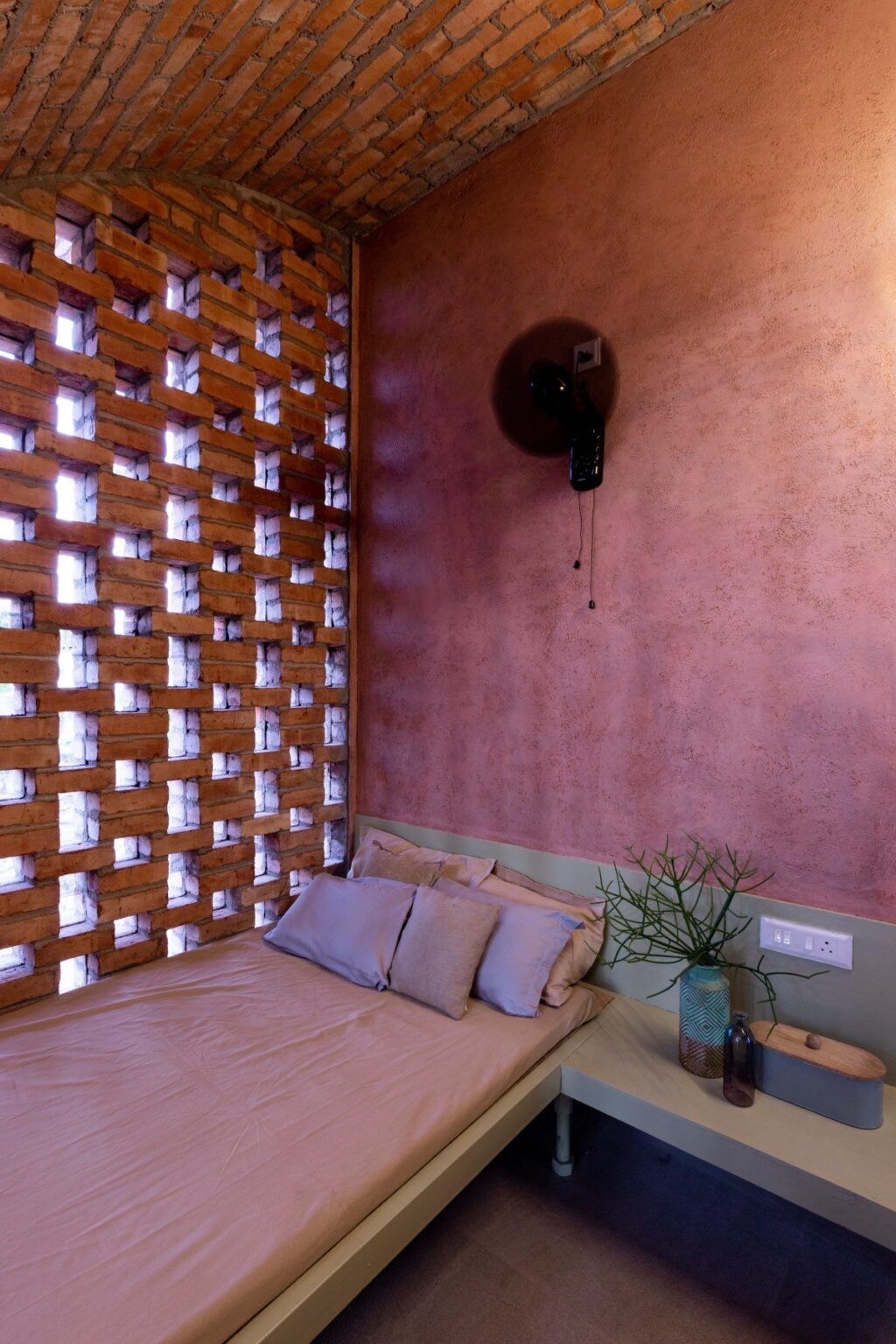 asymmetric brick vaults top NO architects' compact home in india