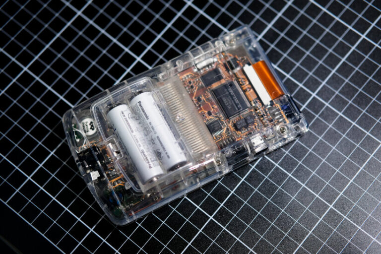 custom nintendo game boy has copper wires on transparent board