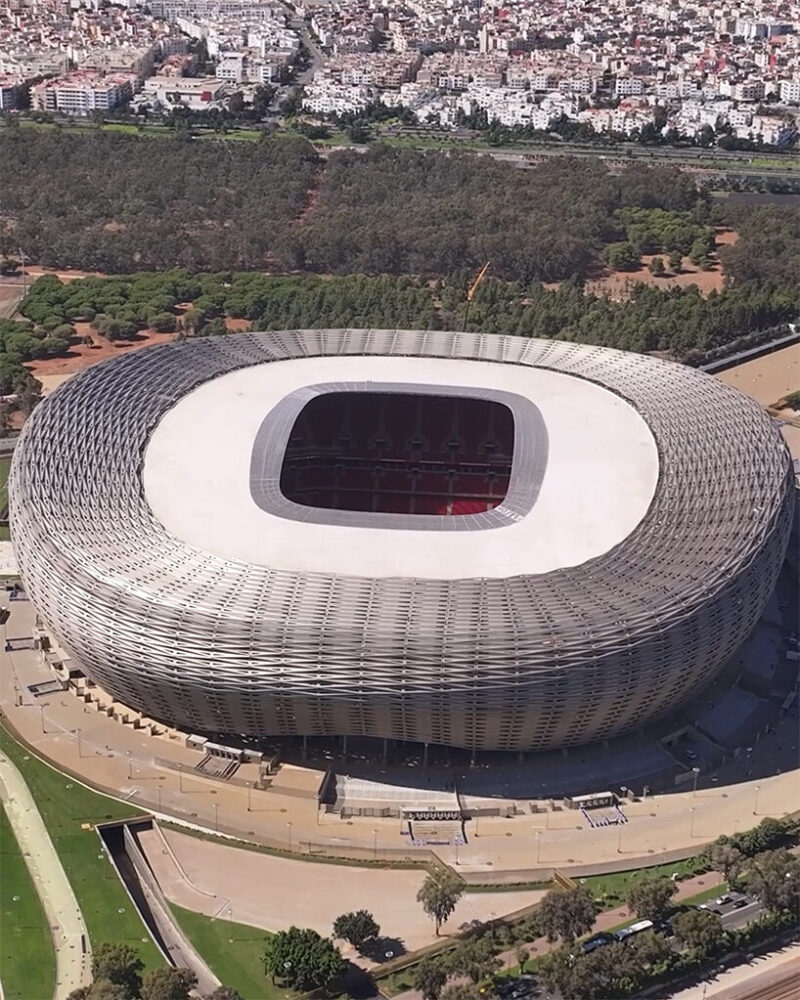 golden triangles compose the facade of populous' stadium in morocco