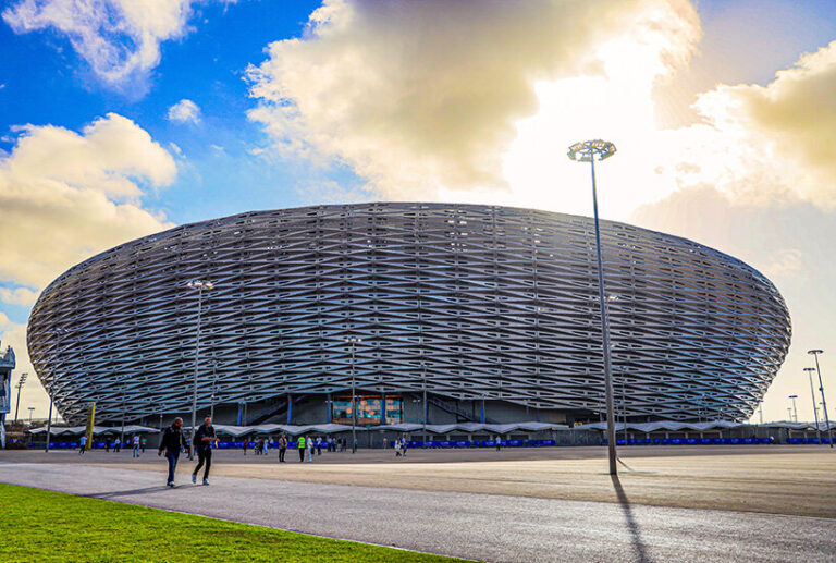 golden triangles compose the facade of populous' stadium in morocco