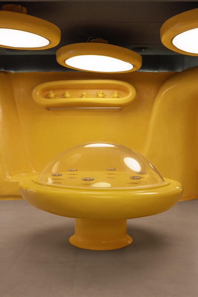 crosby studios builds yellow alien habitat for dessert shop in jakarta