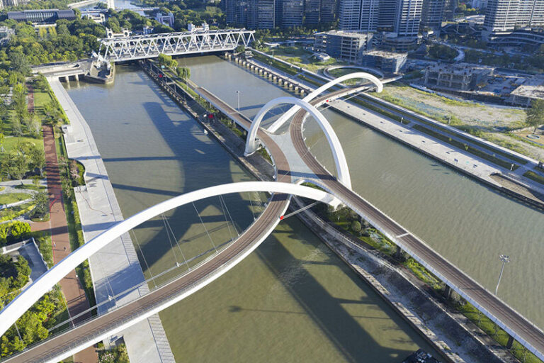 zaha hadid architects draws from silk embroidery with serpentine footbridge