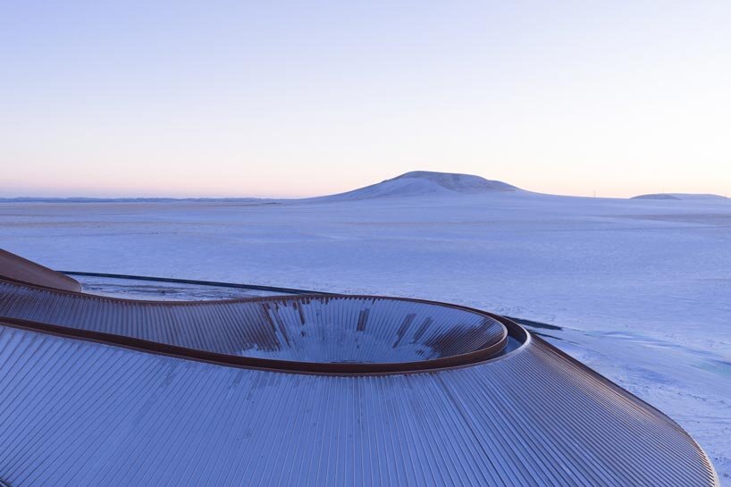 volcano-in visitor center by PLAT ASIA undulates over steppe in china